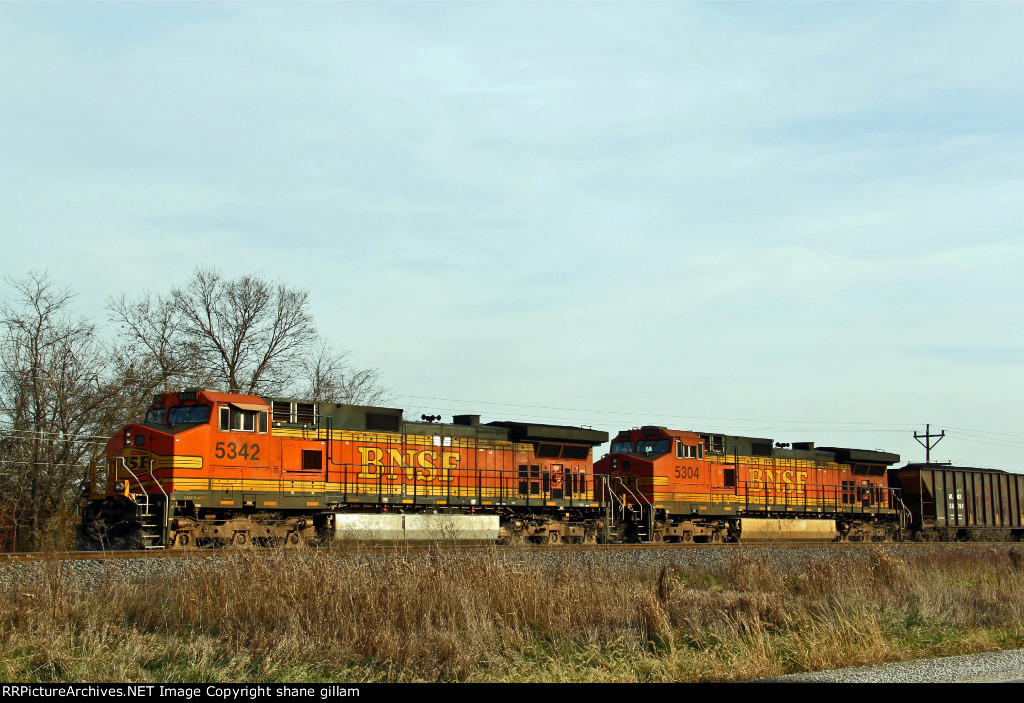 BNSF 5342 and siter dash 9 sit in the siding for track equiment to clear up.